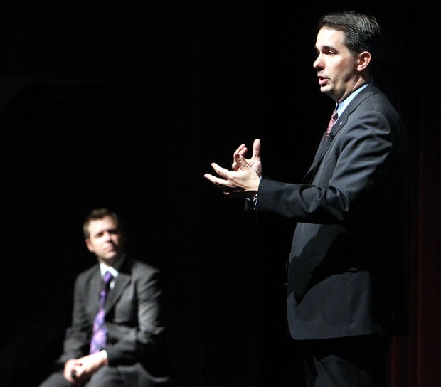 Walker touts low unemployment, surplus in economics forum