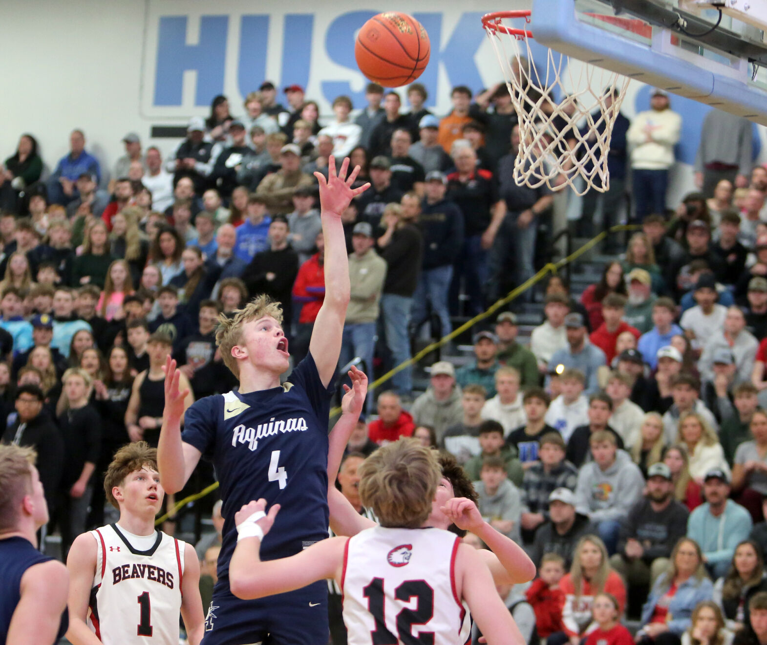 Scenes from Aquinas boys basketball's sectional title win
