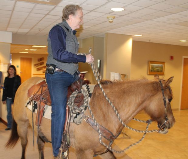 Cowboy doctor rides horse in hospital