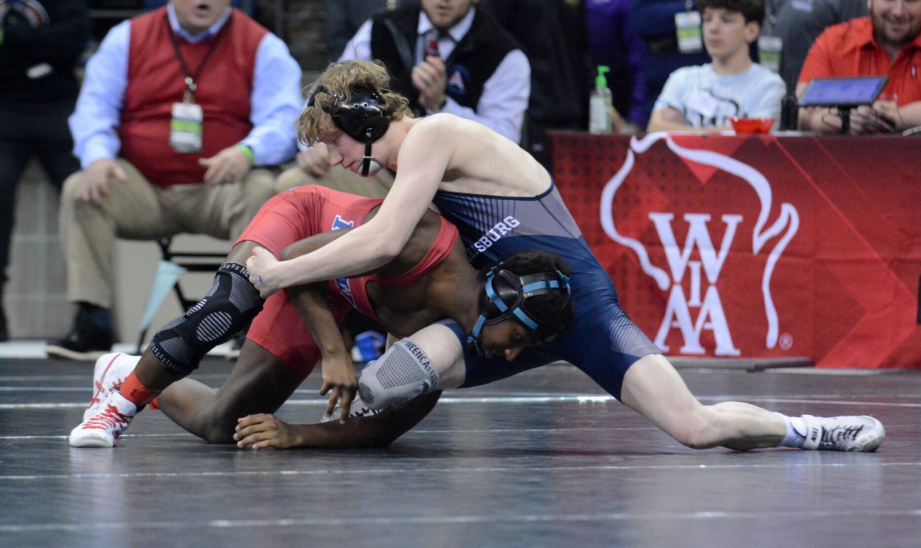 Aquinas with five podium finishes at WIAA wrestling tourney