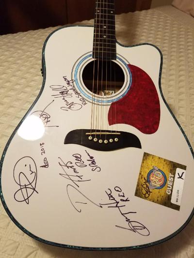 REO Speedwagon-autographed guitar on the auction block