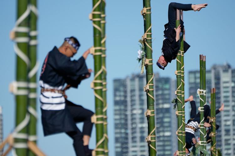 Photos show daring ladder stunts performed by Tokyo's rescue team at ...