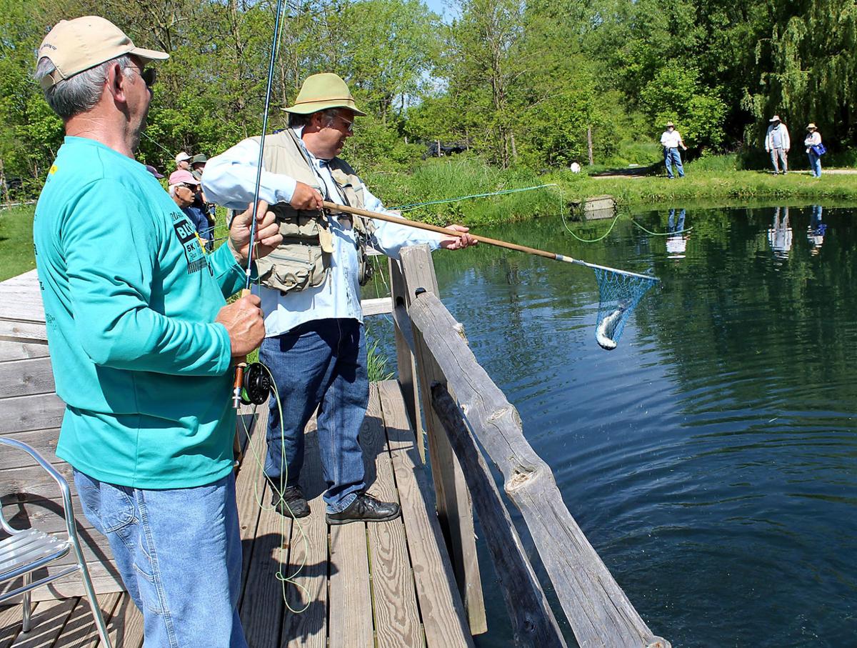 Fly fishing therapy: Instructor directs those with Parkinson’s disease ...