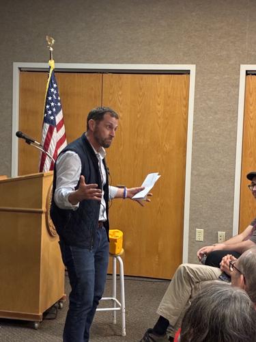 U.S. Rep. Crow, a Colorado Democrat, campaigns against Van Orden in Eau ...