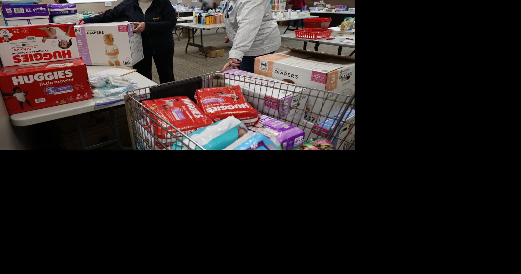 Local groups pack pantry, closet items for Help for the Homeless ...