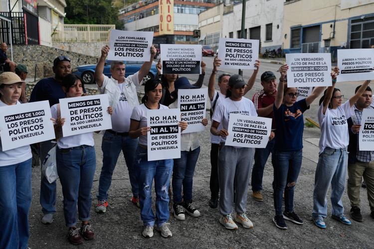 Photos show relatives waiting outside prisons as Venezuela frees a ...