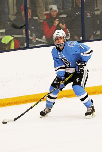 Prep hockey: Huskies score four times in 5:35 at end of first to race ...