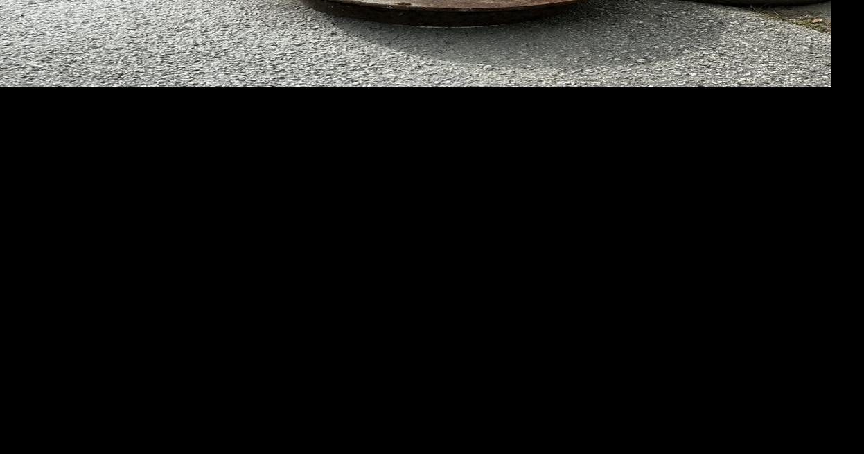 Manhole repair takes place in county parking lot | News | leadertimes.com