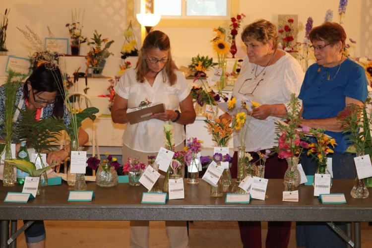 Surrounded by beauty, floral judges try to pick the best of the best ...