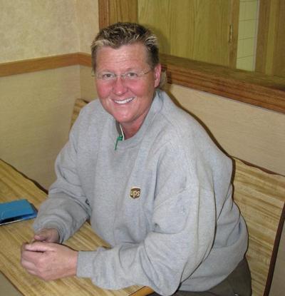 Debban’s smile appears behind every UPS package