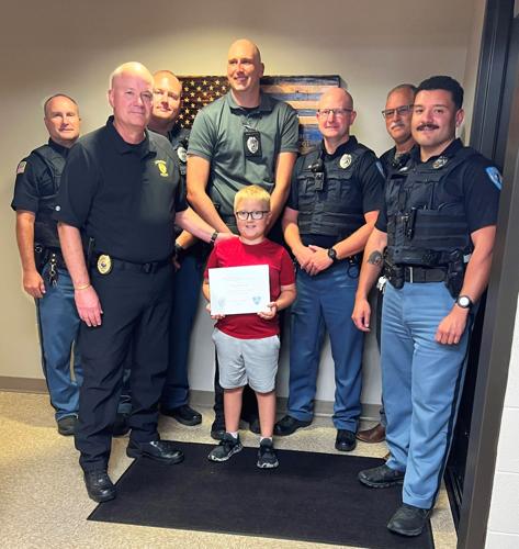Nine-year-old honored by LPD for returning lost $40