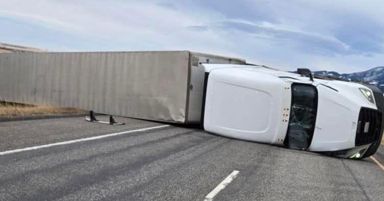 Wind gusts topple semi on interstate, traffic diverted through town ...