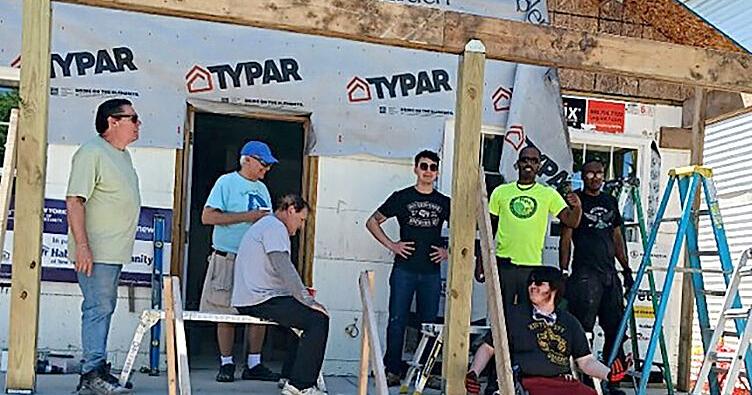 Adult building trades students assist construction of a Habitat house ...