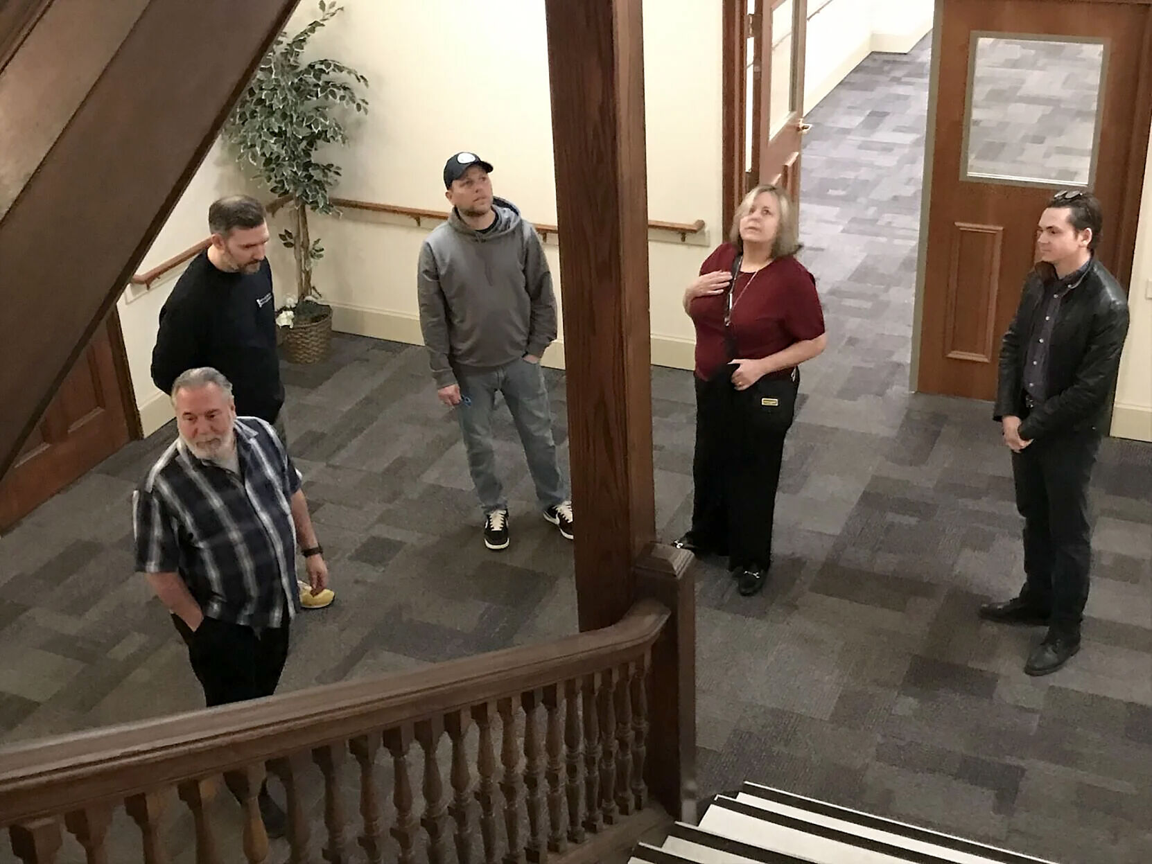 Group looks at staircase in Albion building renovated by PathStone ...
