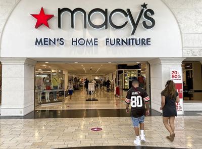 Macy's slashes expectations for the year after a pullback by shoppers in the spring ...