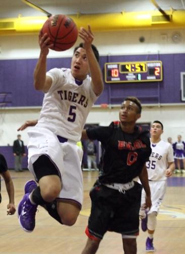 Boys basketball: Tigers roll over Pumas in season opener | Sports ...