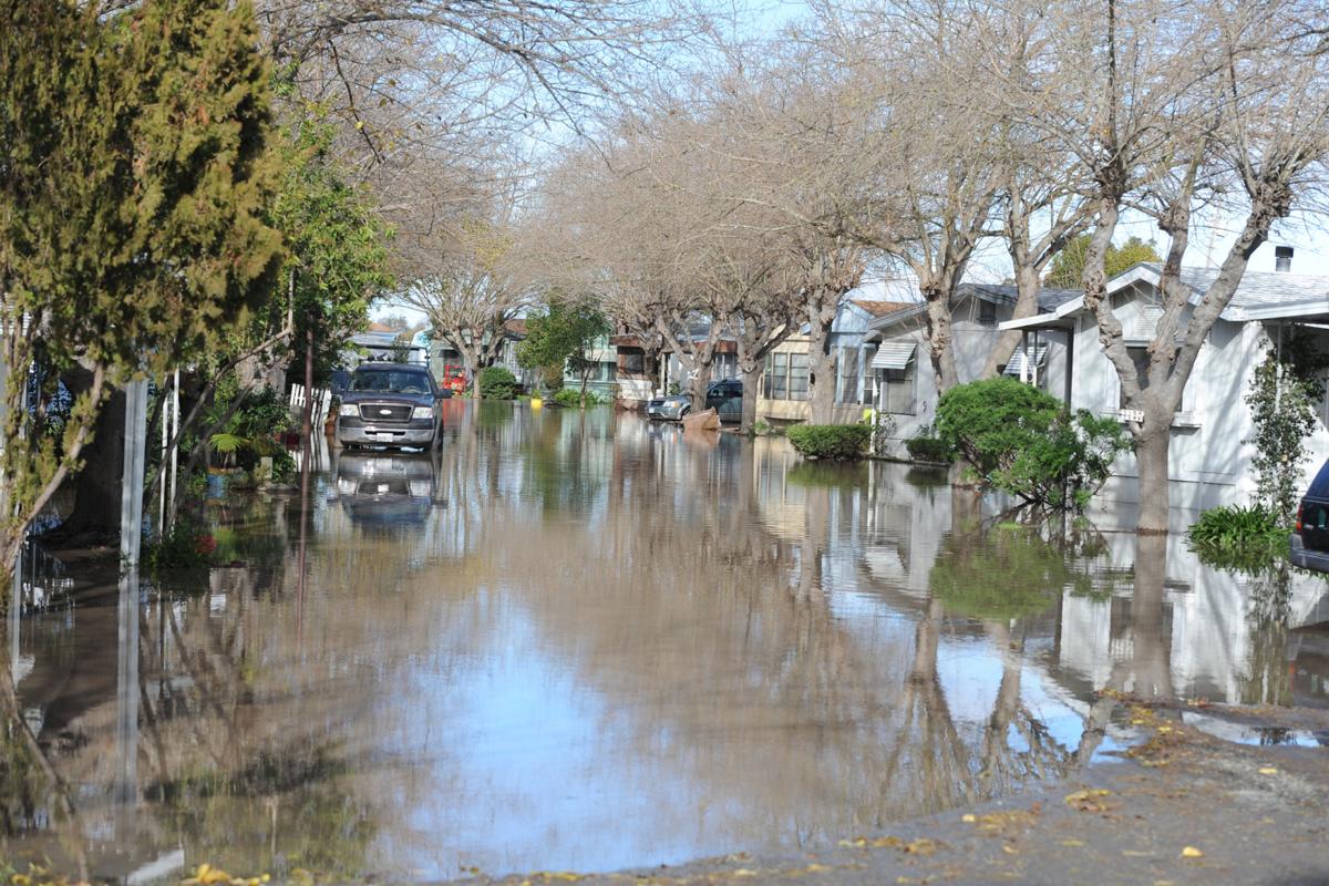 Troubled waters: Storm breaks levees, floods roads in Lodi area and ...