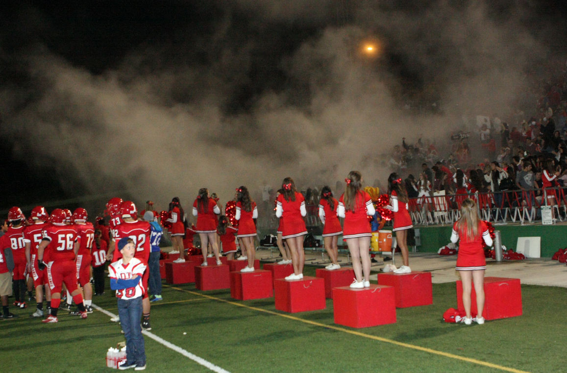 Football: Tigers use big plays to pull away from Flames and win 3rd ...