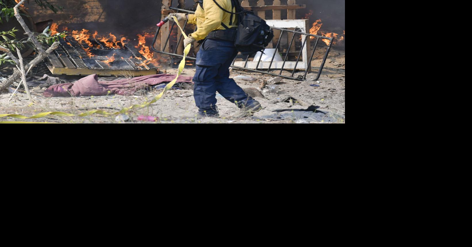 Crews put out third fire in four days at homeless camps in riverbed ...