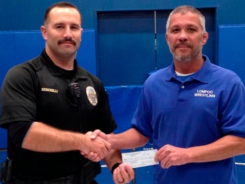 Police organization donates funds to wrestling team | Local News ...