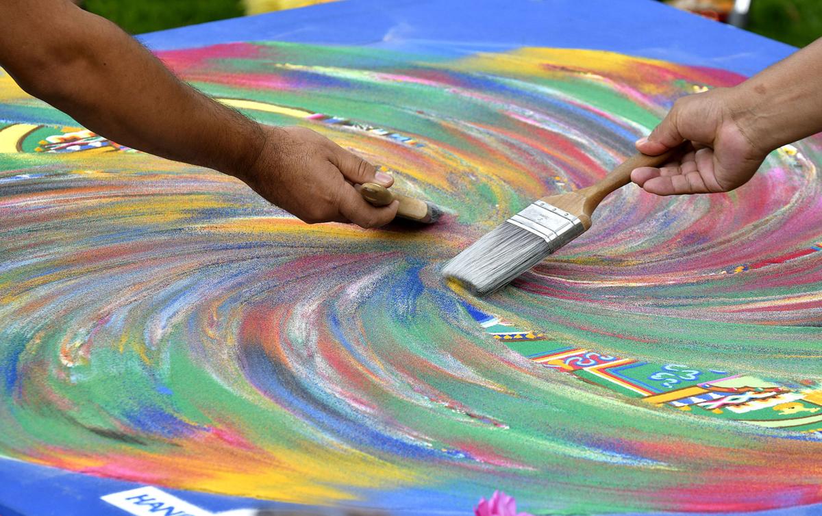 Tibetan monks destroy sand mandala during ceremony at Hancock College ...