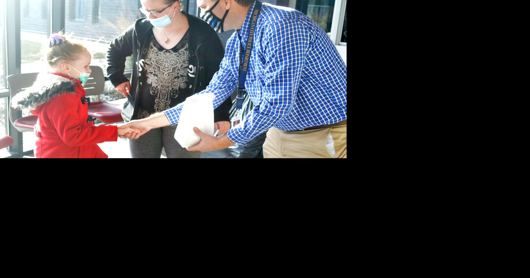 8-tear-old celebrates her birthday by delivering gifts to the Michigan ...