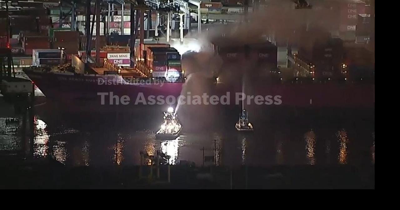 Dozens of firefighters battle blaze on container ship docked at LA port ...