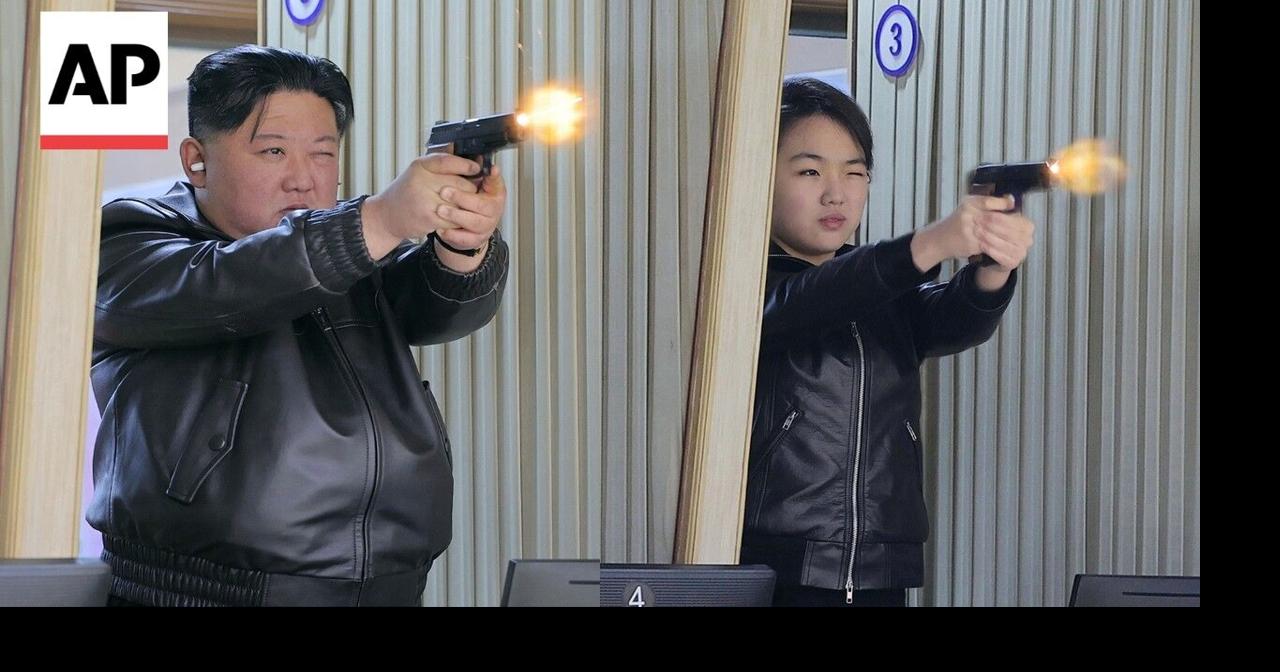 Kim Jong Un and his daughter shoot guns at North Korea weapons factory ...