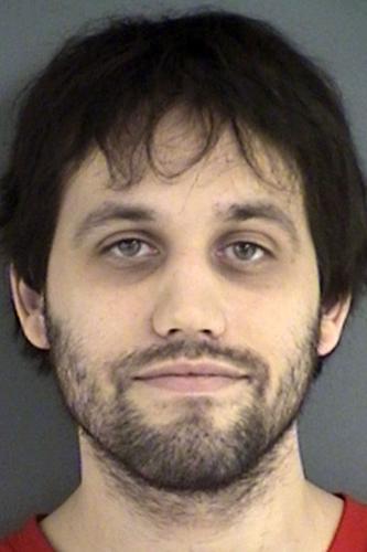 Campuses go into lockdown after man walks down 69 with rifle | Local ...