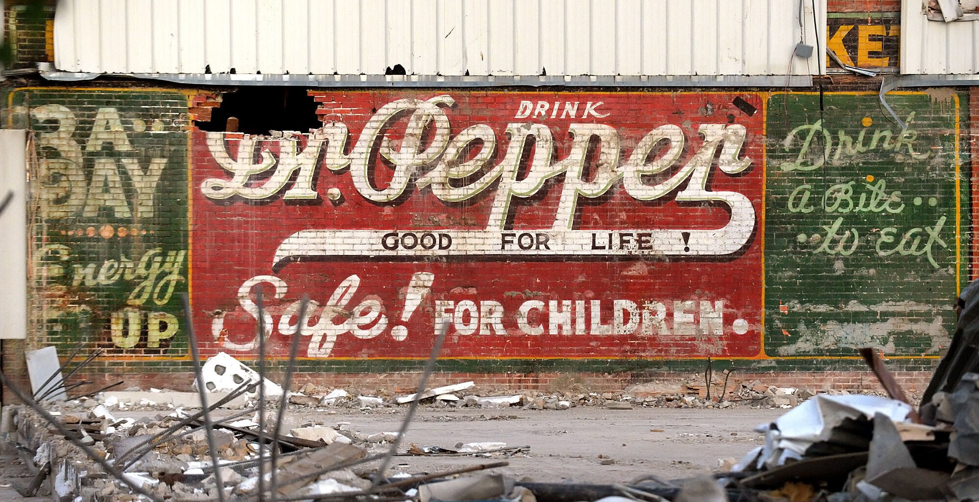 Soda relic pops up: Jail demolition reveals hidden Dr Pepper mural ...