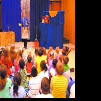 Performers entertain children as part of T.L.L. Temple Memorial Library ...