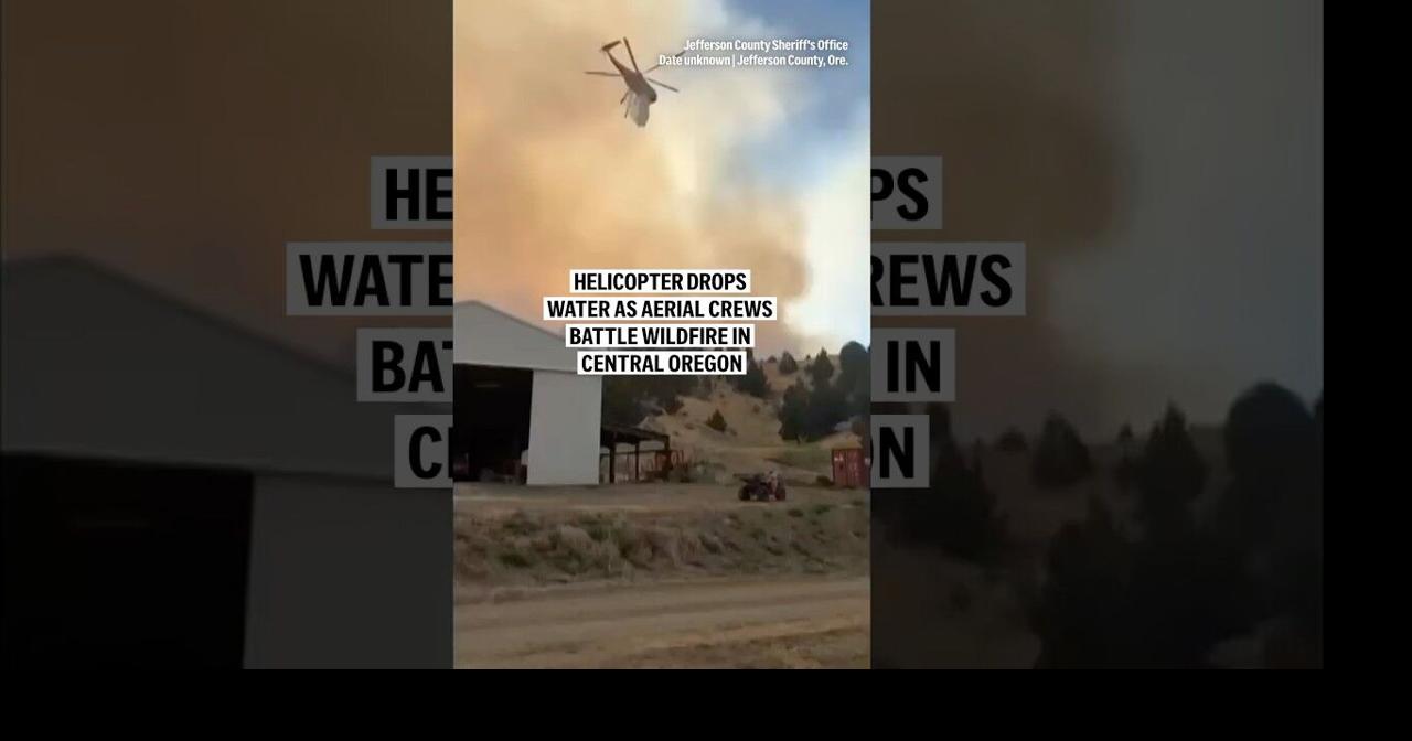 Helicopter drops water as aerial crews battle wildfire in Central ...