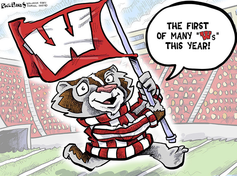 Hands on Wisconsin: Bucky's flag is the first of many Ws this year.