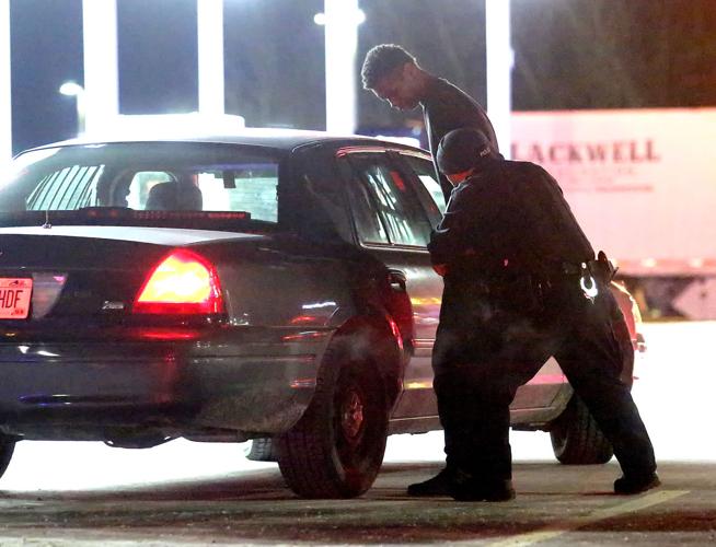 Four charged with Friday phone store robbery