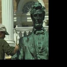 The Lincoln statue atop Bascom Hall gets scrubbed