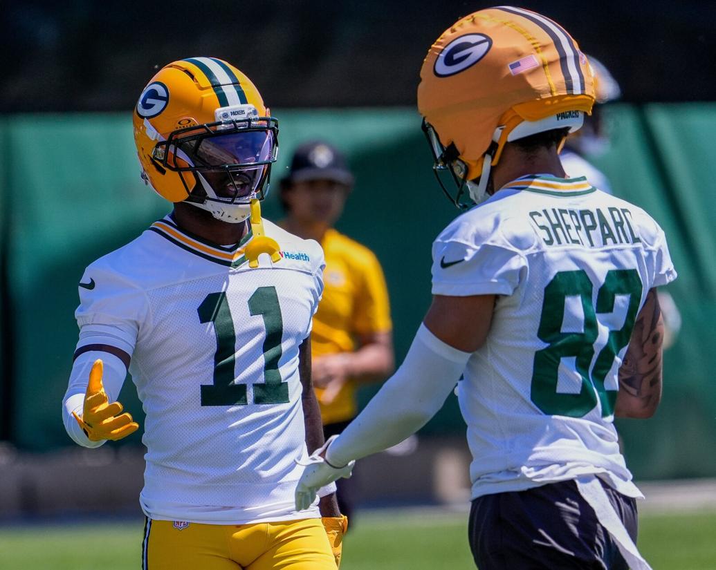 Green Bay Packers wide receiver Jayden Reed (11) gives encouragement to ...