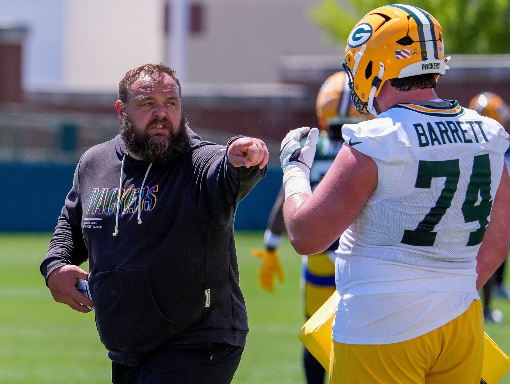 Green Bay Packers offensive line coach Luke Butkus gives instructions ...