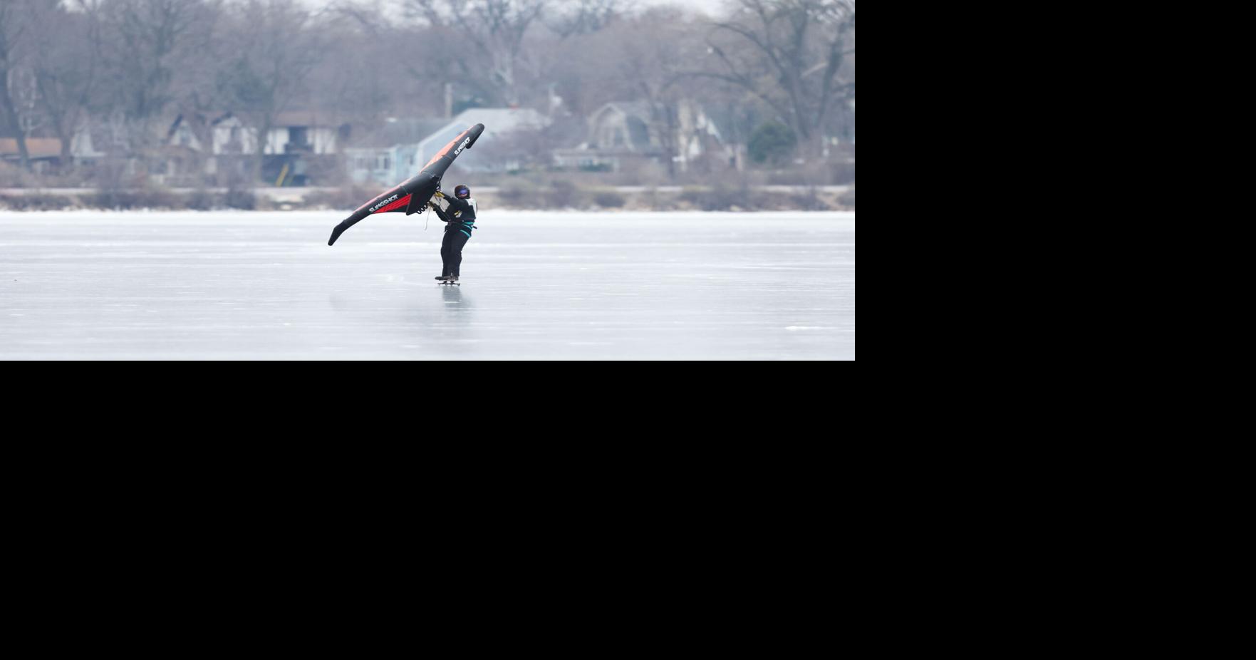 Wind surfer catches a gust of wind on Monona Bay in Madison