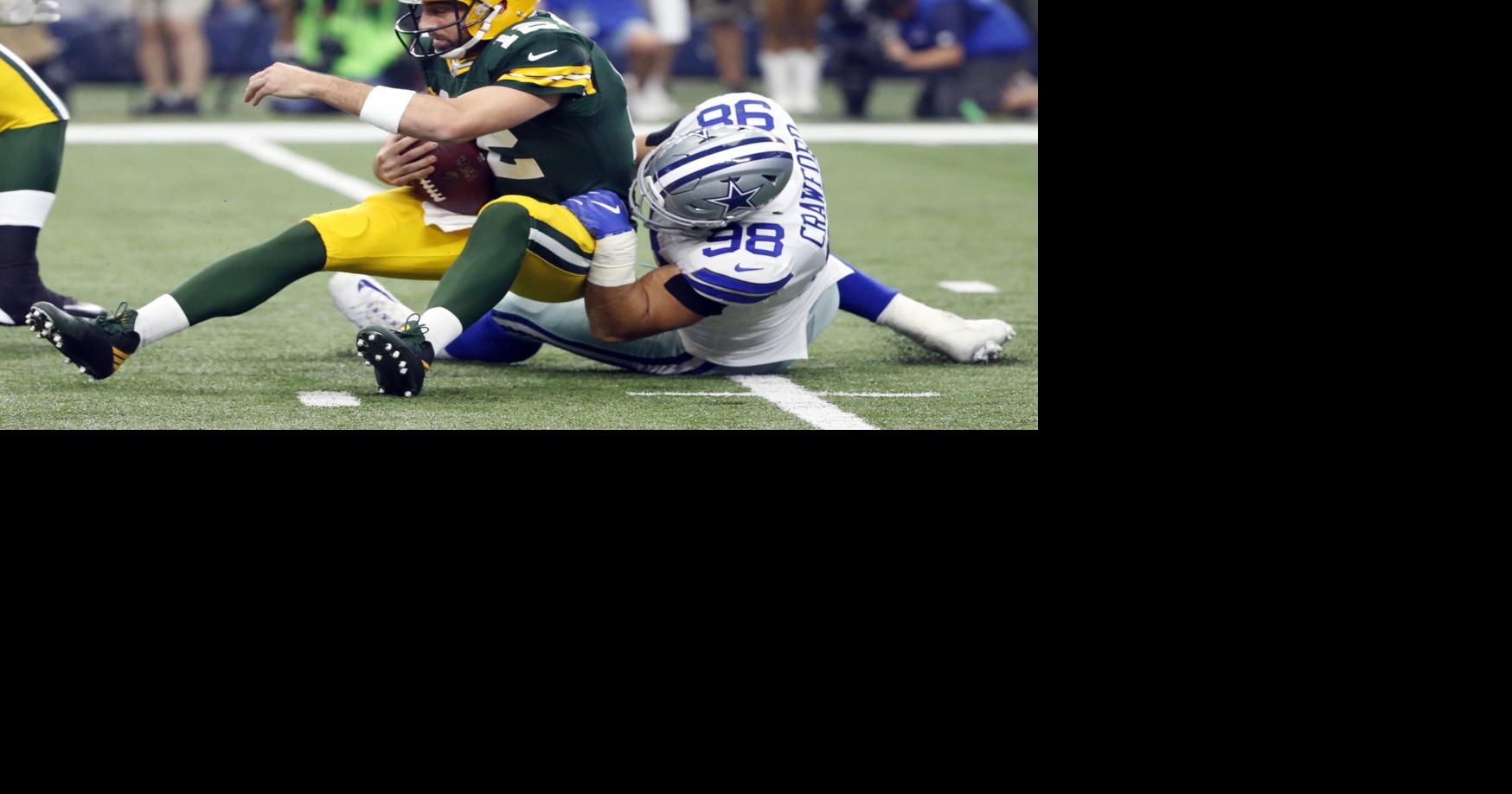 Aaron Rodgers sacked, AP photo