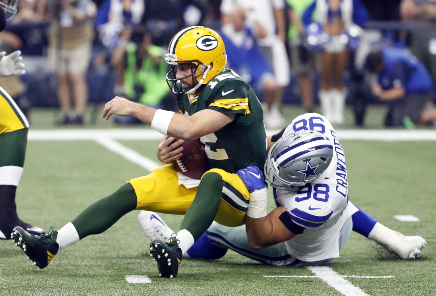 Aaron Rodgers sacked, AP photo