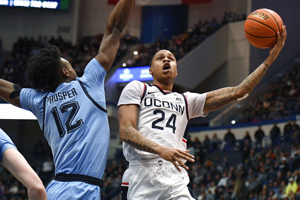 Newton's triple-double powers No. 21 UConn over No. 10 Marquette