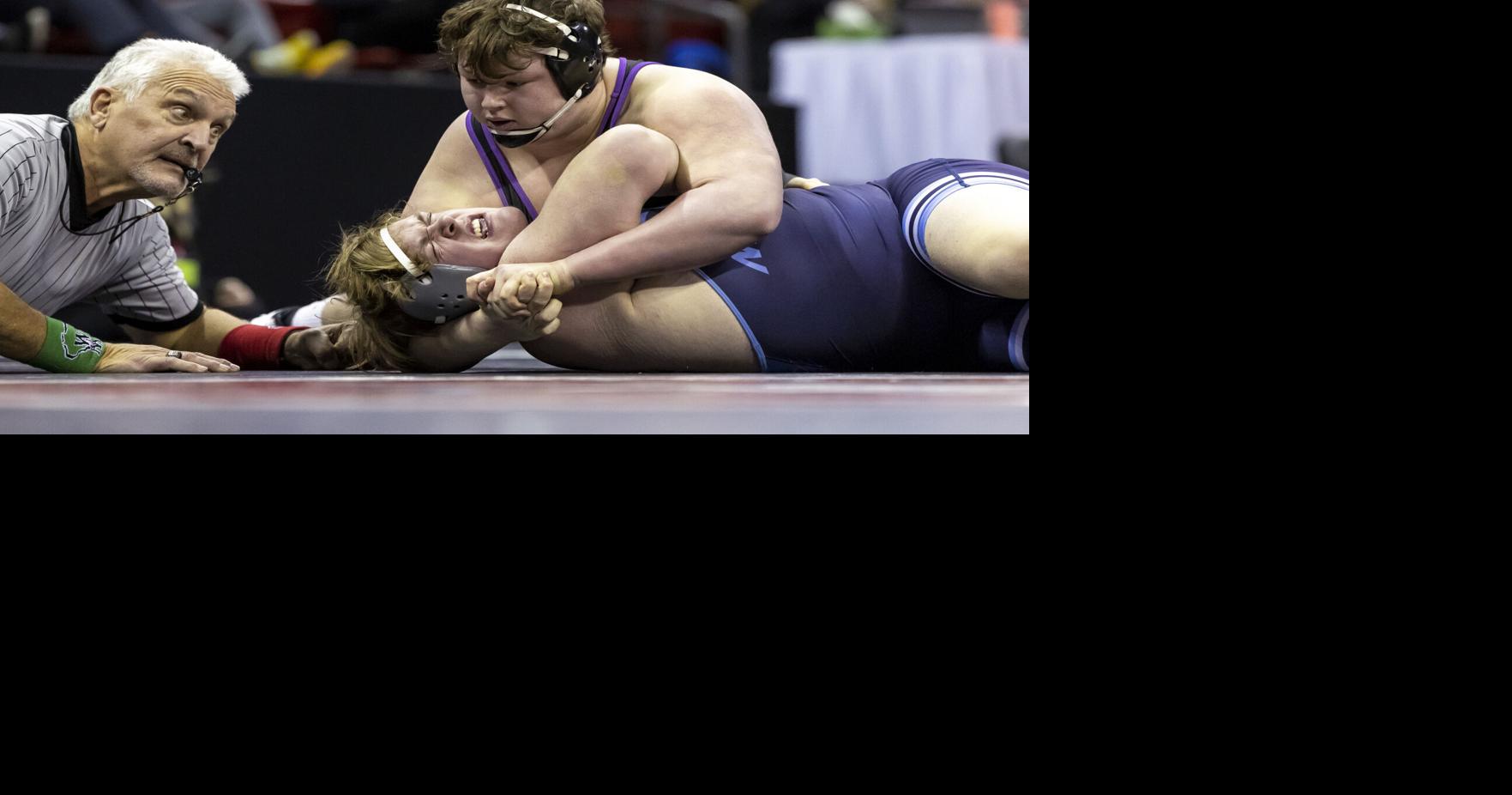 Heavyweights utilize football skill sets on wrestling mat