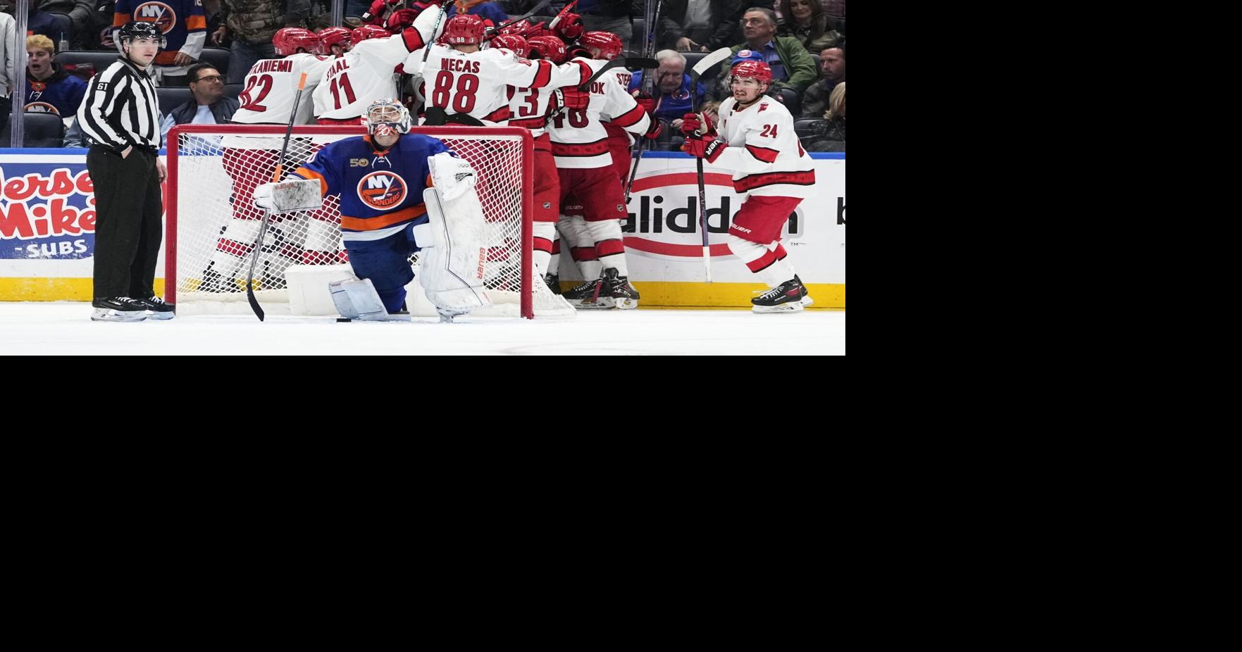 Canes oust Islanders in OT