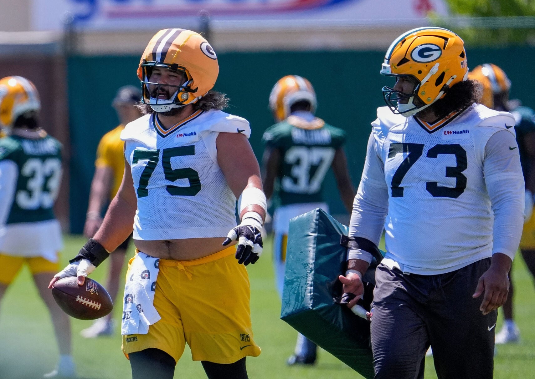 Green Bay Packers offensive linemen Sean Rhyan (75) and John Williams ...