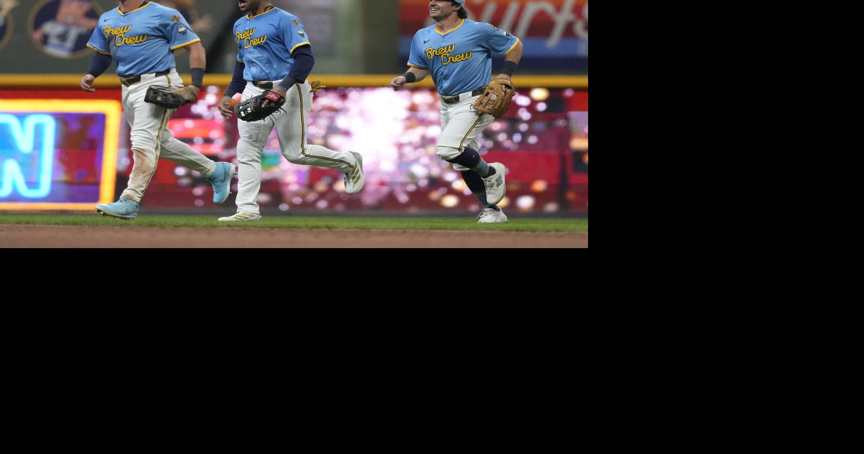 Brewers hold off skidding Mets thanks to Perkins' throw