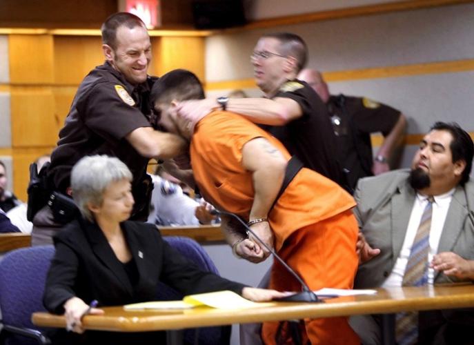 Man charged in two killings erupts in court outburst