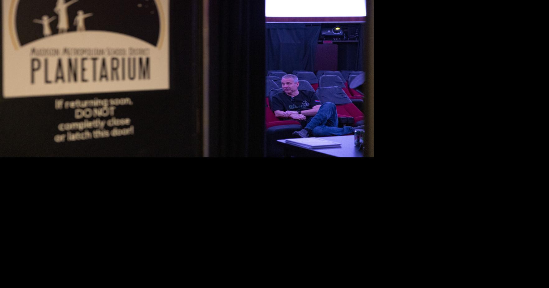 Planetarium sign with Senson in background