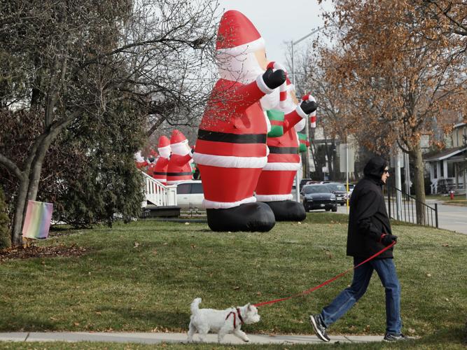 32 inflatable Santas bring spirit to Monroe Street