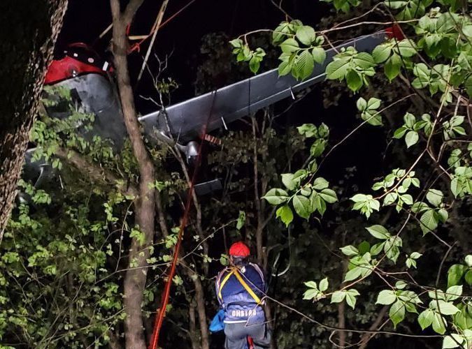 Plane, 3 passengers, left suspended in state forest trees after crash