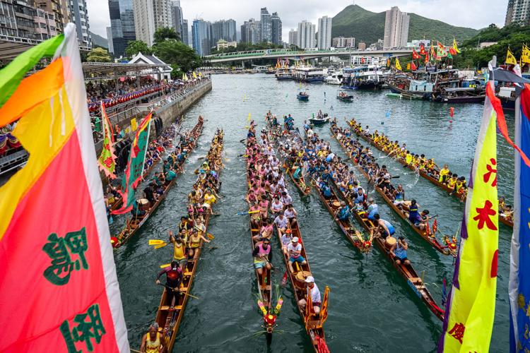 Competitiors take part in boat races to mark the Dragon Boat Festival ...